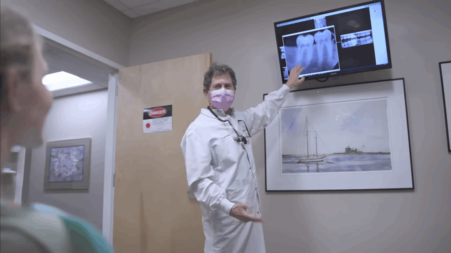 Periodontist with x-ray and patient - Virginia Family Dentistry